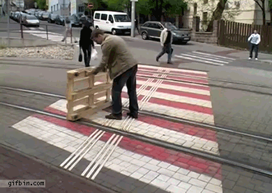 Gifbin - Shipping pallet on the tram tracks (Reverse Gif)